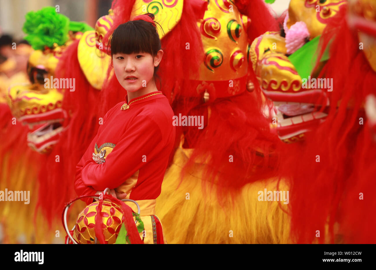Chinese artists perform a traditional lion dance at the opening ...