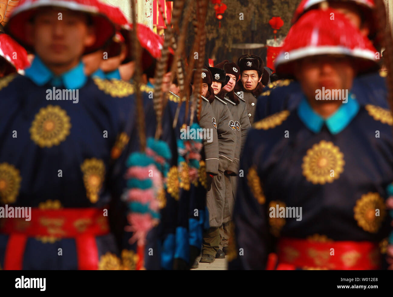 Chinese soldiers dressed as Qing Dynasty guards and as an emperor ...