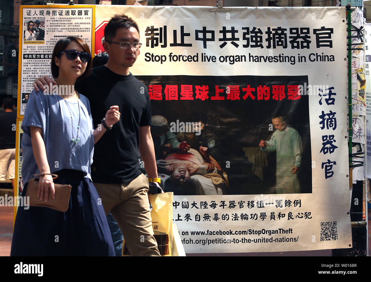 A religious organization, labeled a cult by China, holds a sidewalk ...