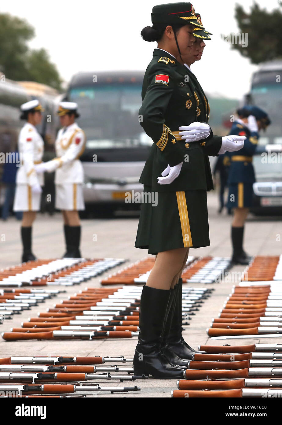 Chinese soldiers prepare to perform honor guard duties at a welcoming ...