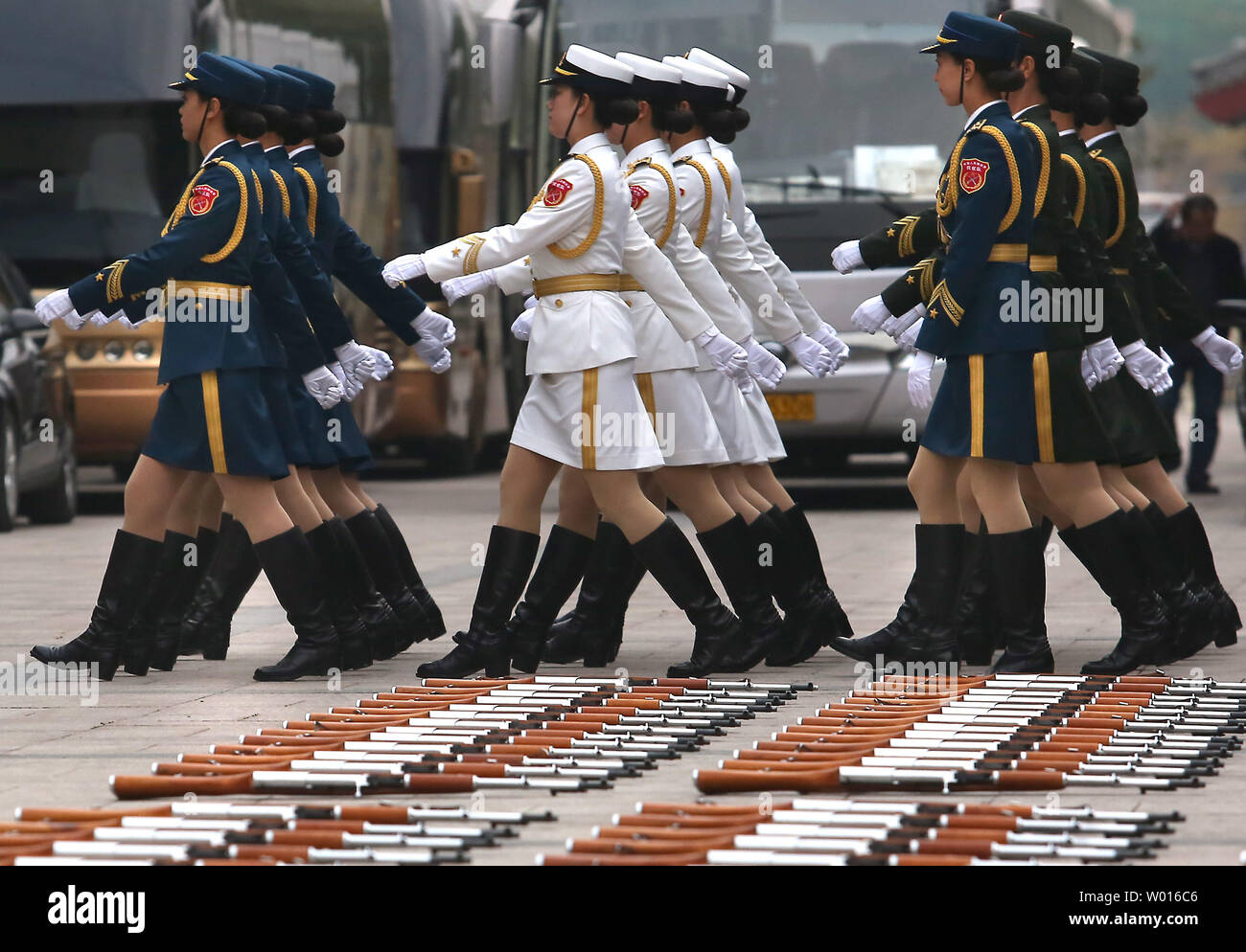 Chinese soldiers prepare to perform honor guard duties at a welcoming ...
