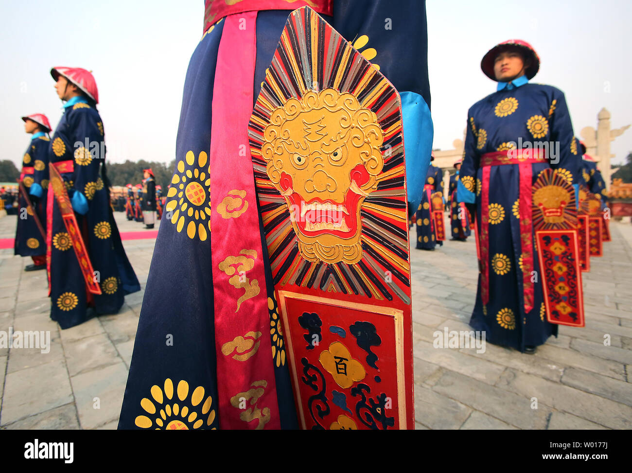 Chinese soldiers dressed as Qing Dynasty guards and as an emperor ...