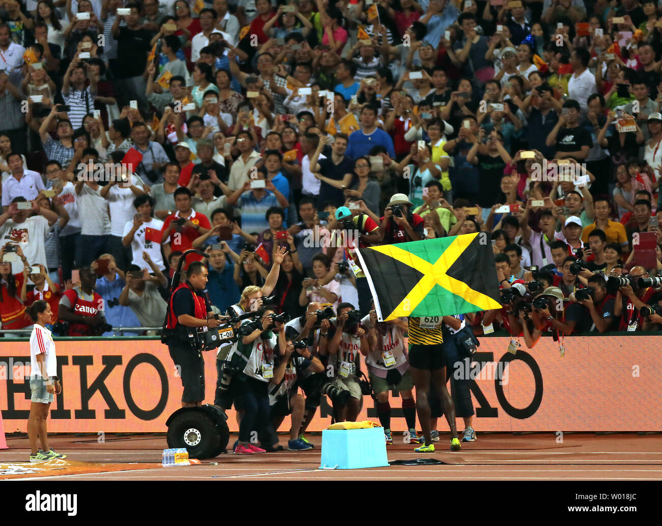 Jamaica's Usain Bolt salutes the crowd after winning the100 meters ...