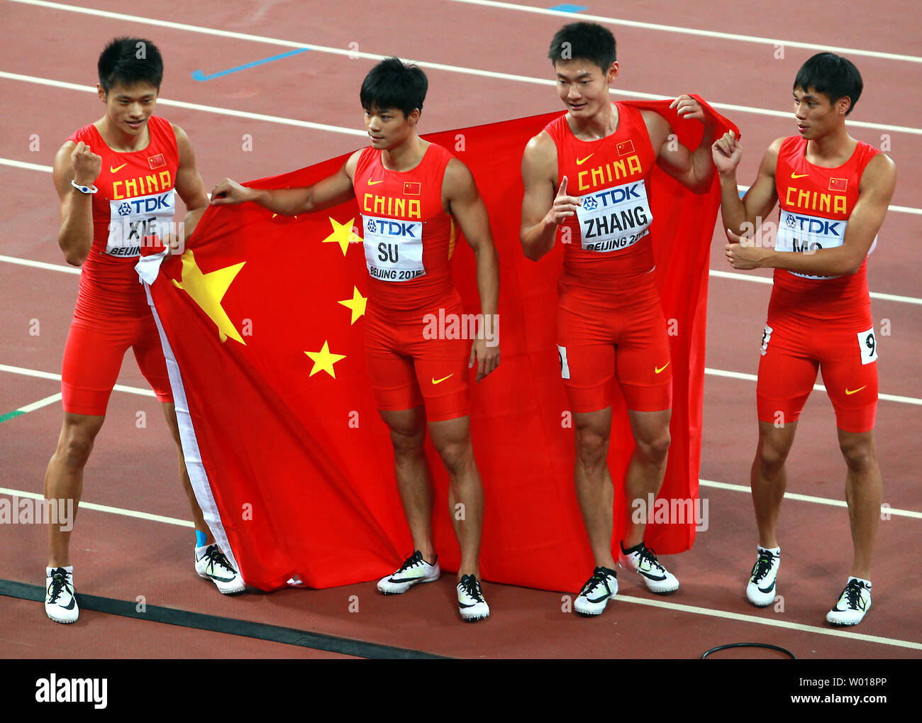 China's (L-R) Xie Zhenye, Su Bingtian, Zhang Peimeng and Mo Youxue pose ...