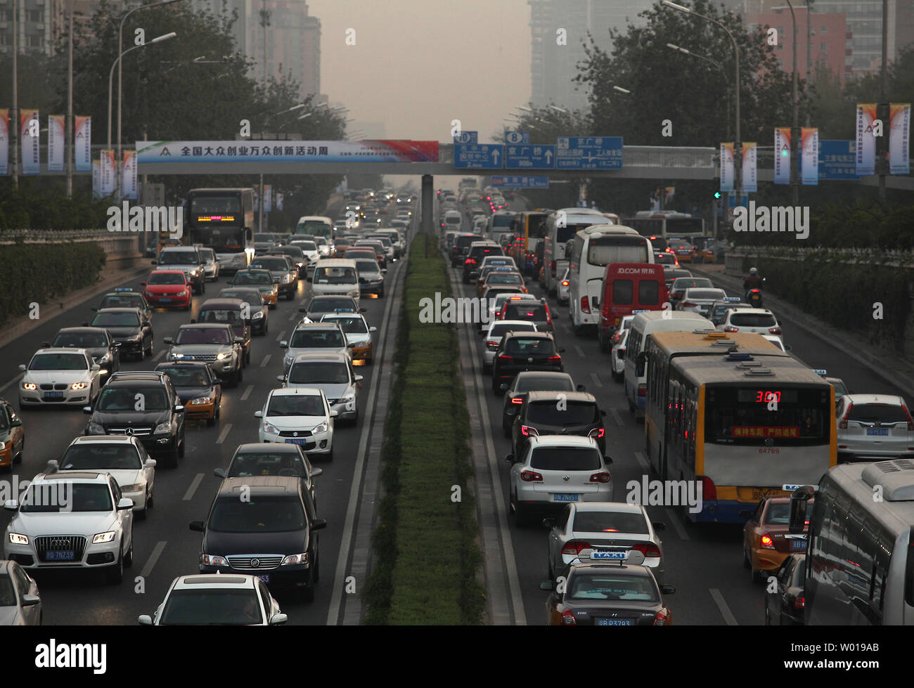 Heavy traffic inches along a main road running through Beijing's ...