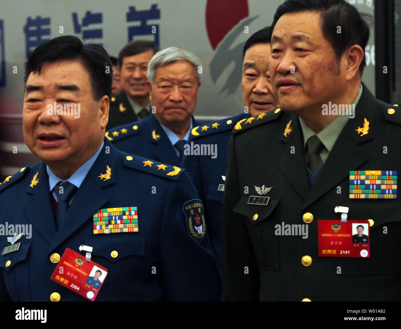 Chinese military delegates arrive for the opening session of the ...