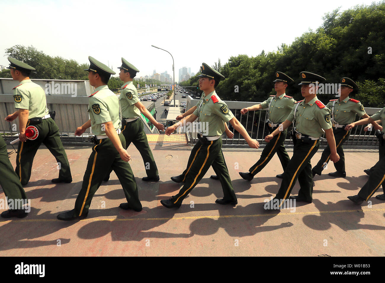 Chinese soldiers patrol central Beijing on June 8, 2016. Public ...