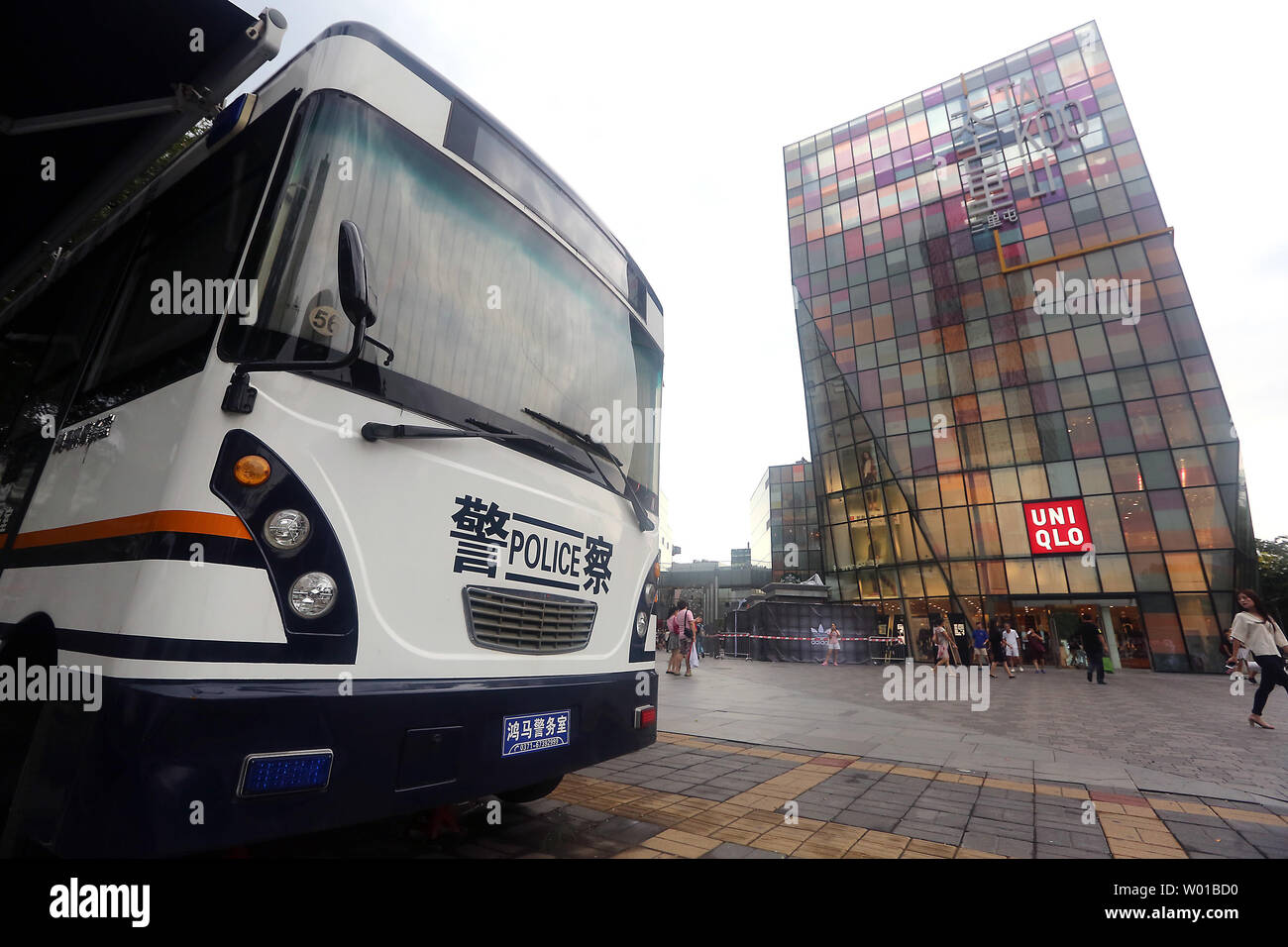 A Chinese police van, manned by English speaking officers, is parked ...