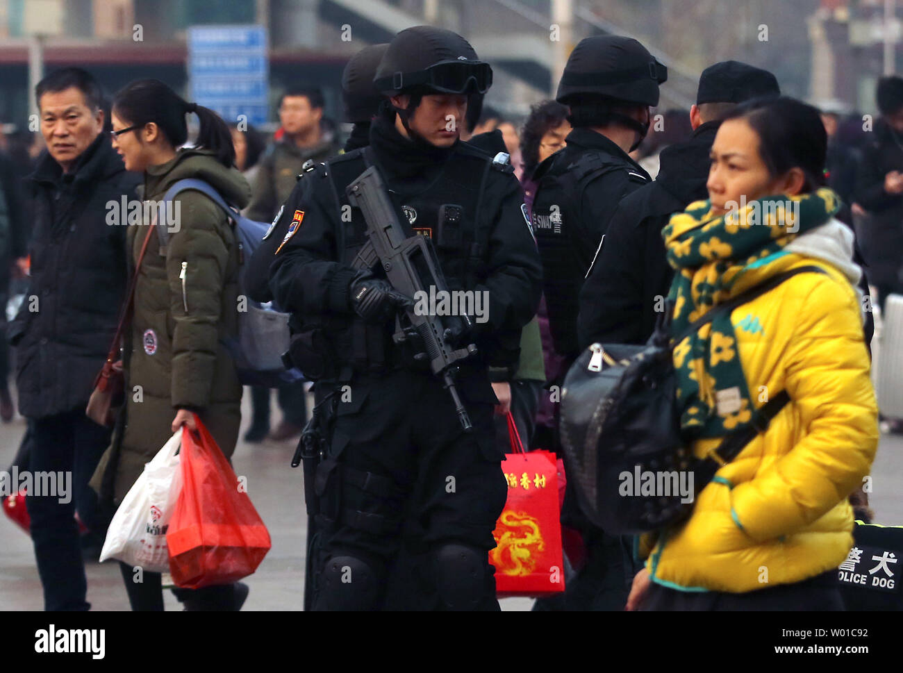 A Chinese SWAT team stands watch as Chinese head to one of the capital ...