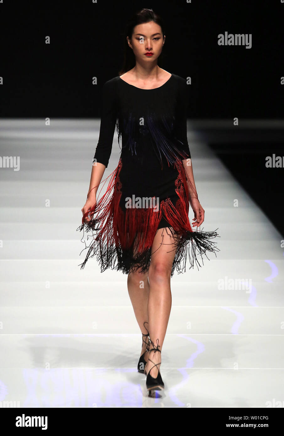 Chinese models wear dresses made by Chinese fashion designer Tom Dong ...