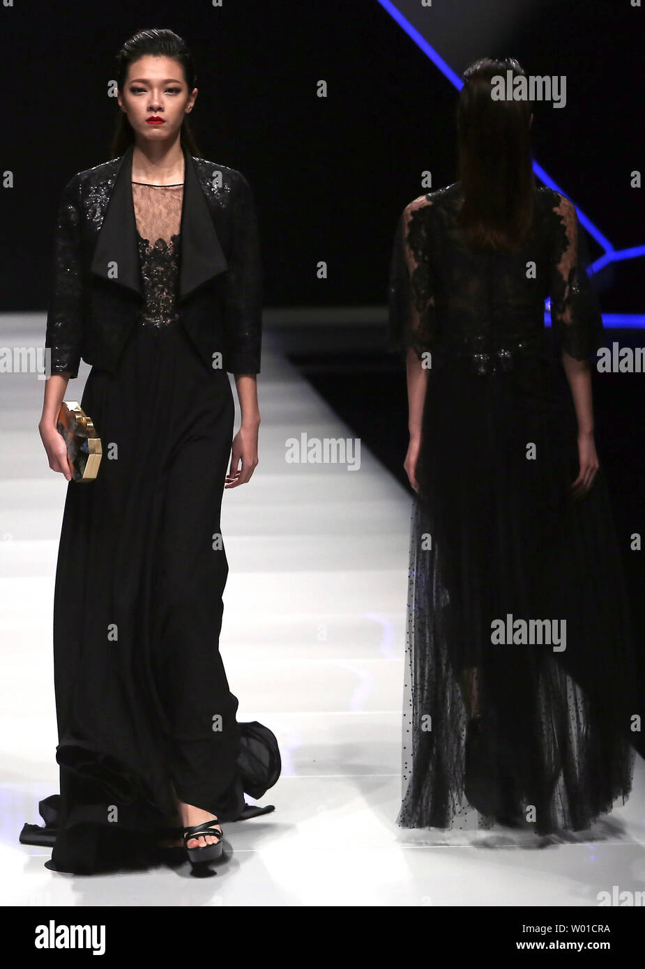 Chinese models wear dresses made by Chinese fashion designer Tom Dong ...
