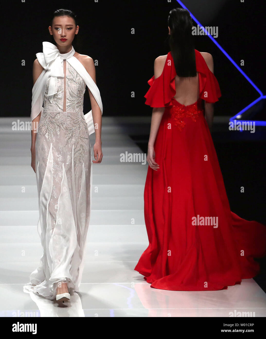 Chinese models wear dresses made by Chinese fashion designer Tom Dong ...