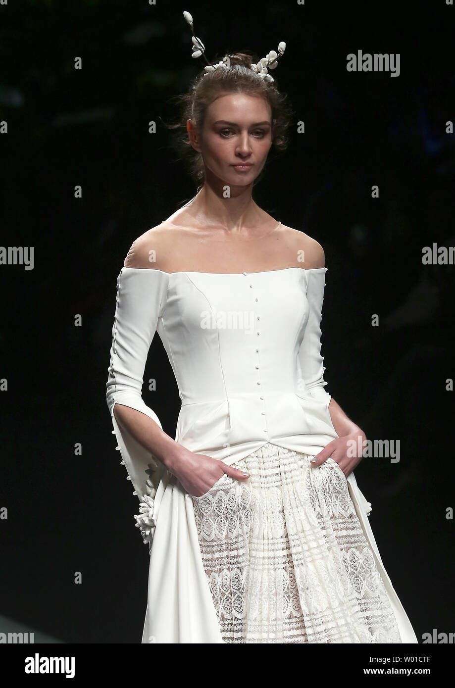 European models wear dresses from the Jusere bridal collection made by ...