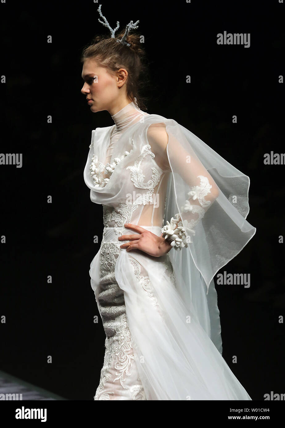 European models wear dresses from the Jusere bridal collection made by ...