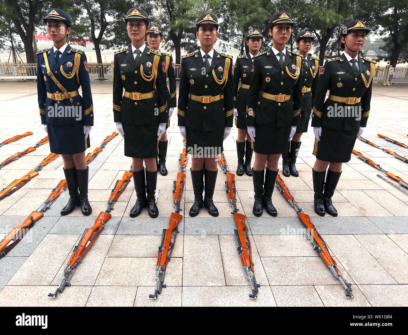 Chinese female soldiers prepare to perform honor guard duties for a ...