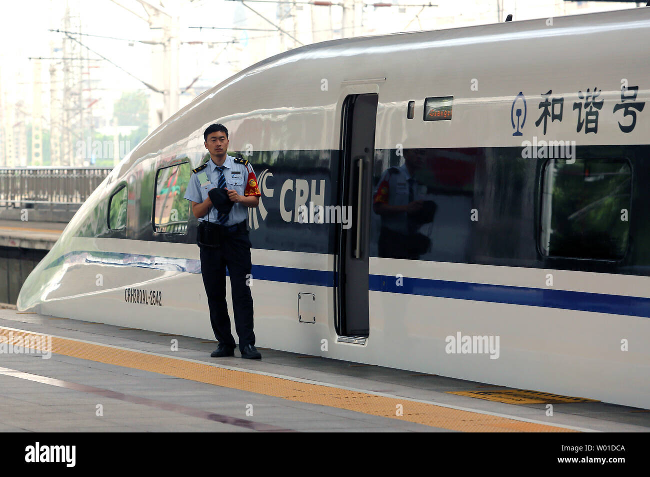 A Chinese security guard stands next to one of China's newest and ...