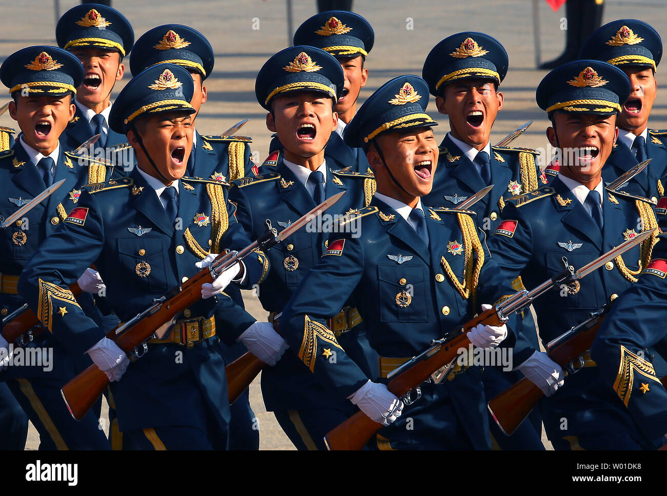 Chinese soldiers perform military honor guard duties for a welcoming ...