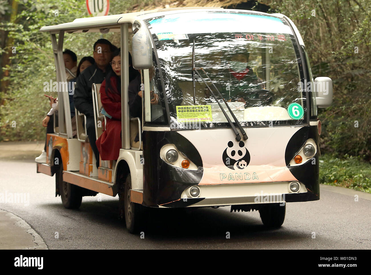 Chinese ride a shuttle through the Panda Research Base in Chengdu ...