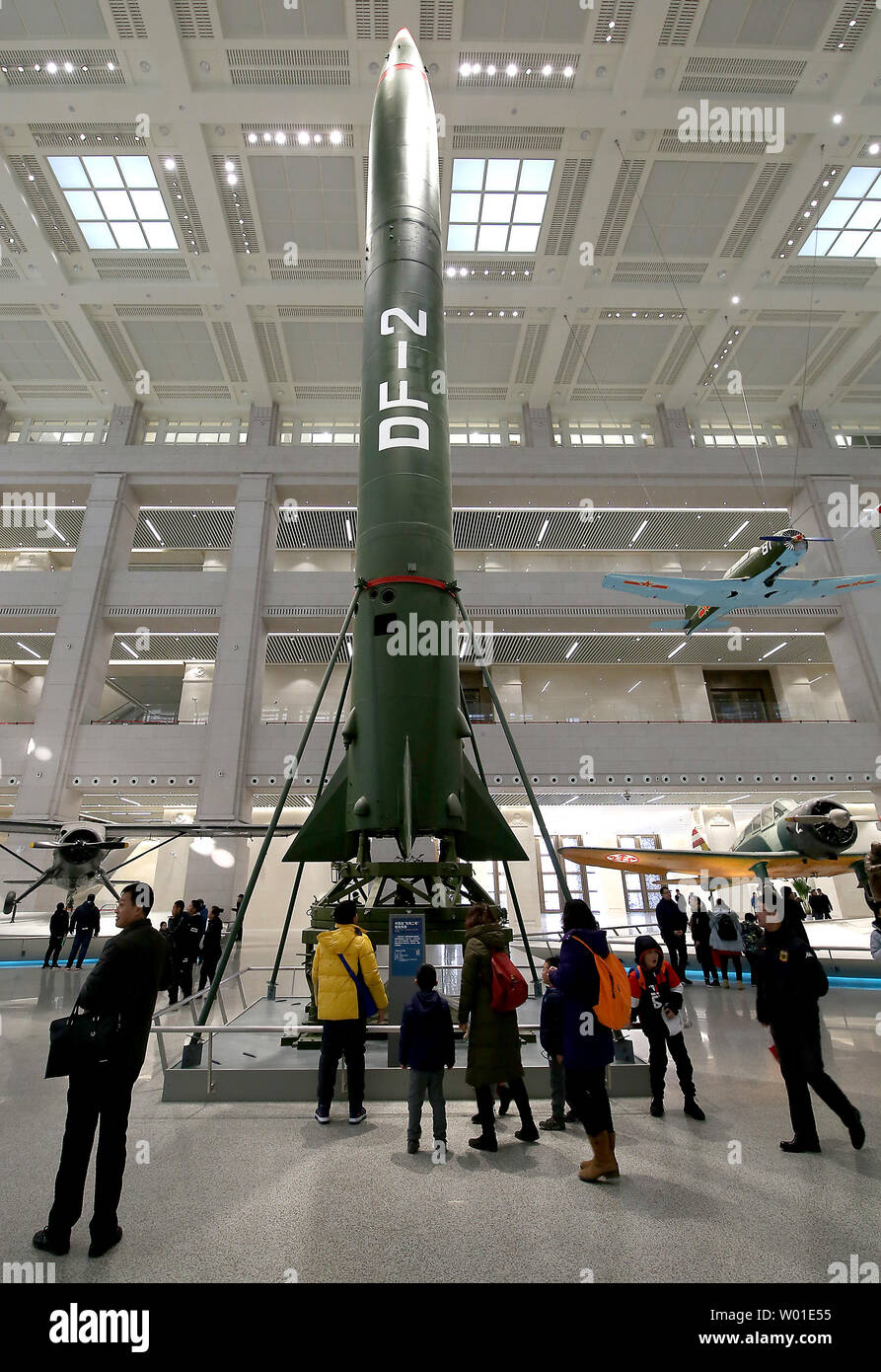 Chinese look at the DF-1 and DF-2 ballistic missiles on display at the ...