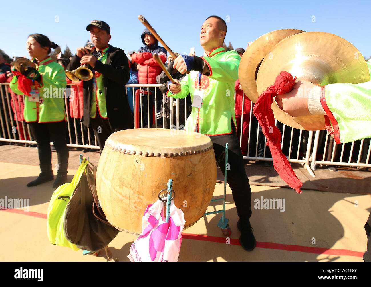 Chinese musicians play traditional instruments during a temple park's ...