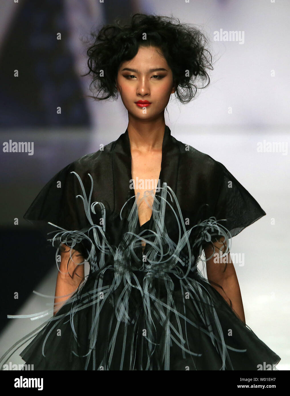 Chinese models wear clothing by designer Chen during the annual China ...