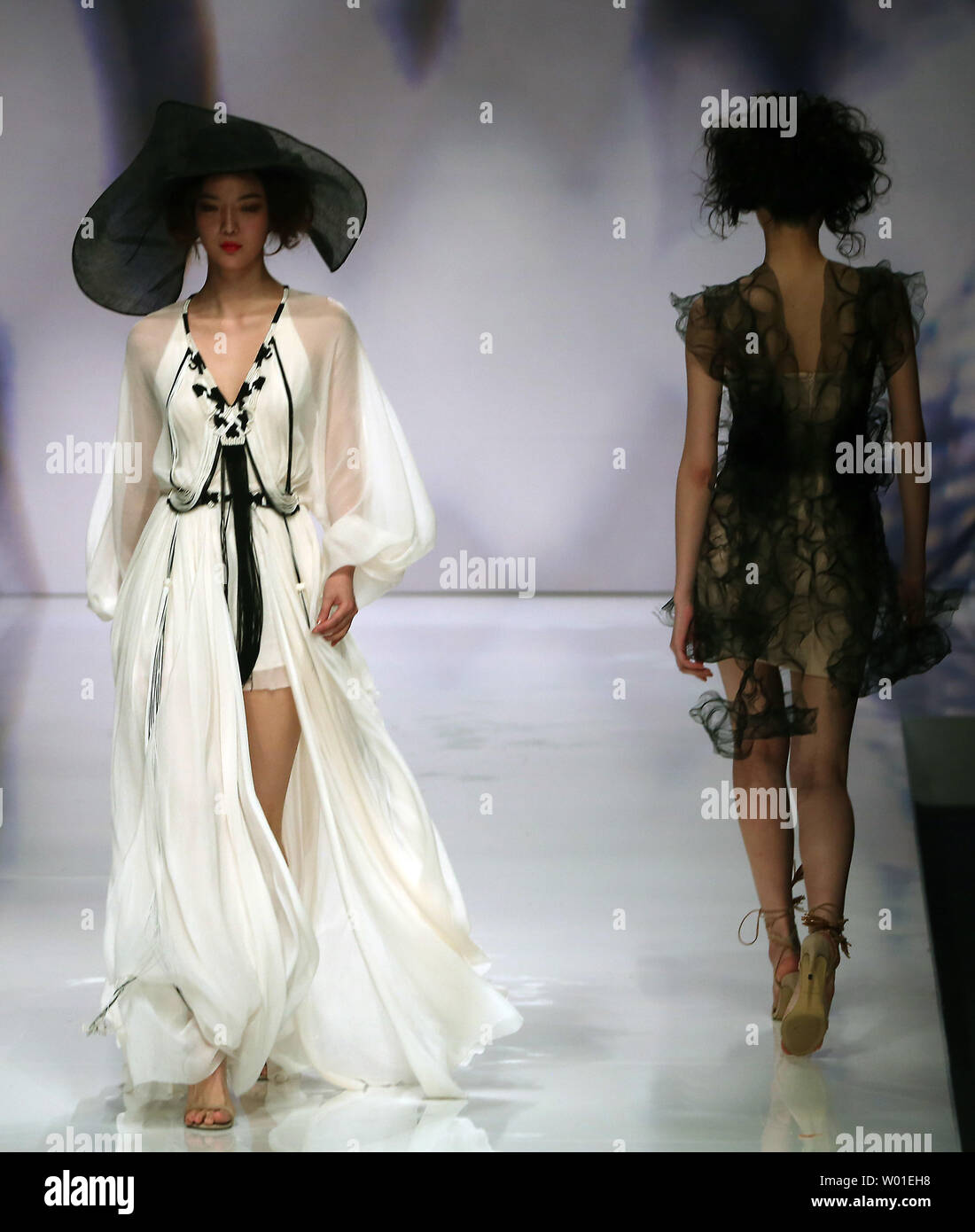Chinese models wear clothing by designer Chen during the annual China ...