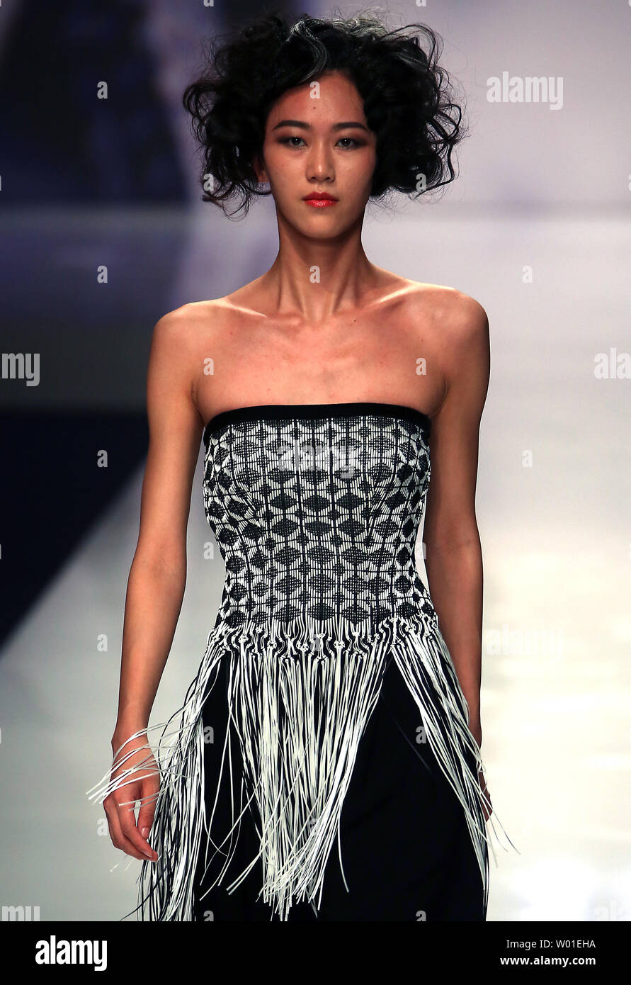 Chinese models wear clothing by designer Chen during the annual China ...