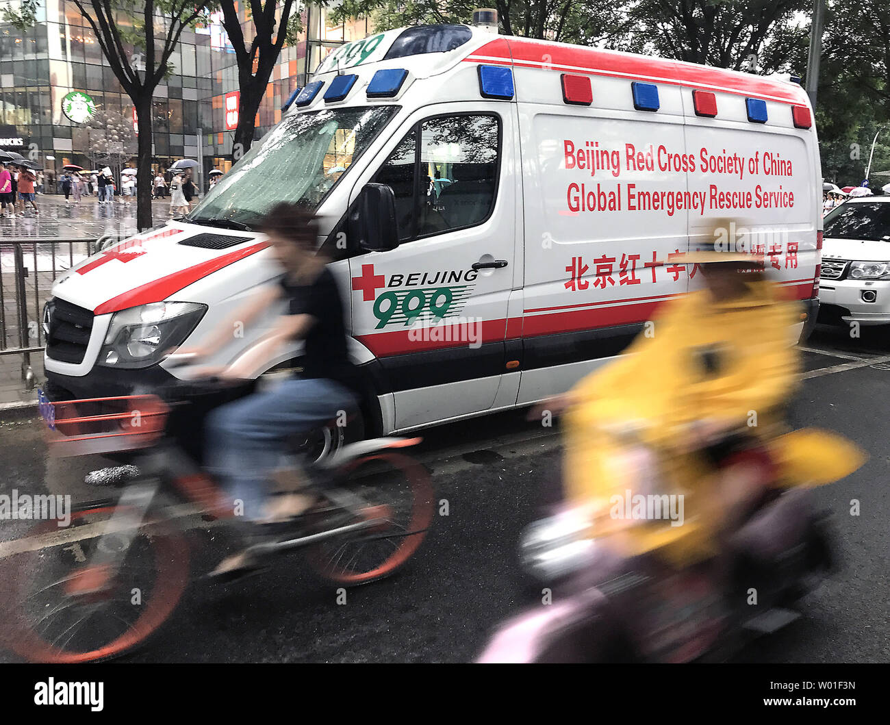A Beijing Red Cross Rescue van is parked outside a major international ...
