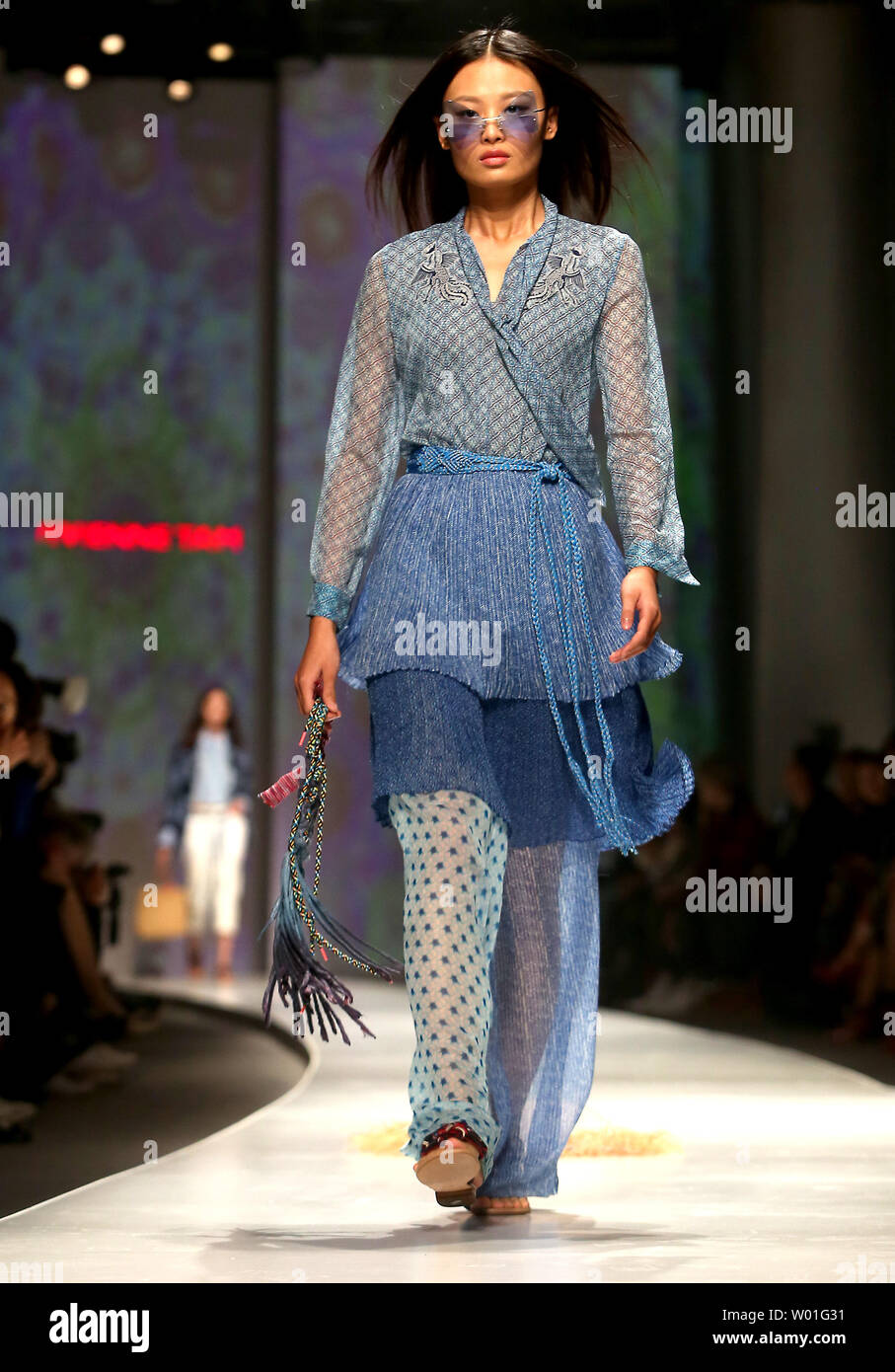 Models wear the latest designs from Vivienne Tam during the annual ...