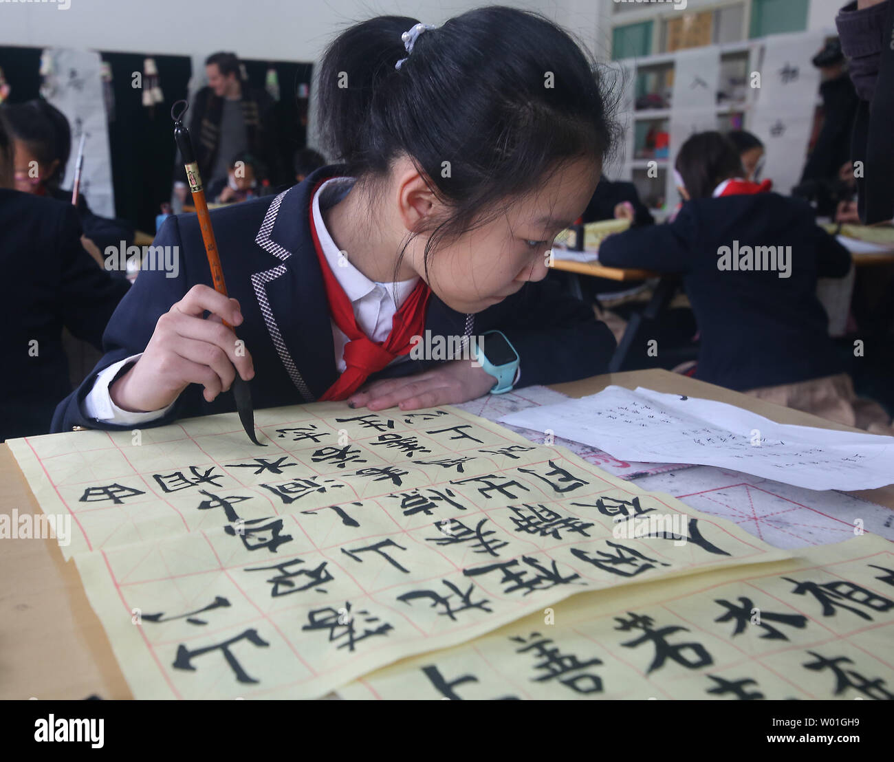 Chinese students practice traditional calligraphy at the young ...
