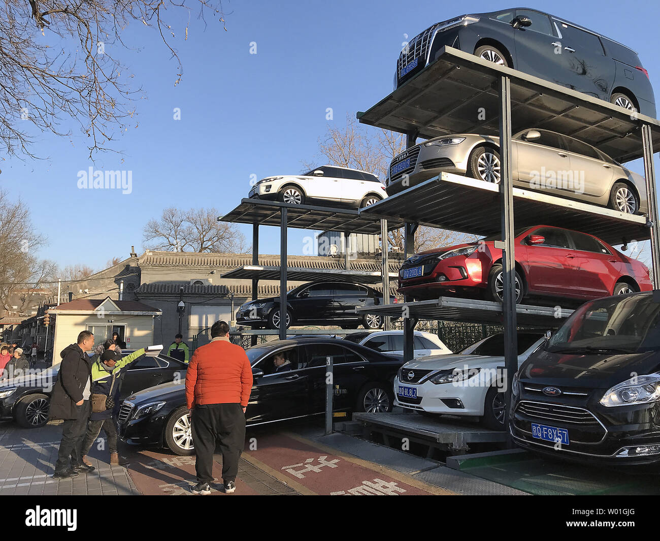 A Chinese man parks his Mercedes at a new, outdoor parking facility in ...