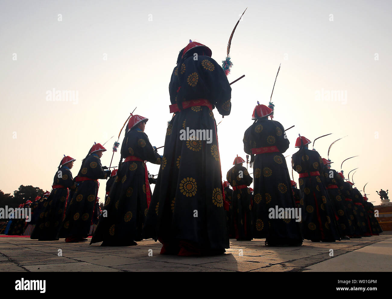 Chinese soldiers dressed in imperial garb act out a traditional ...