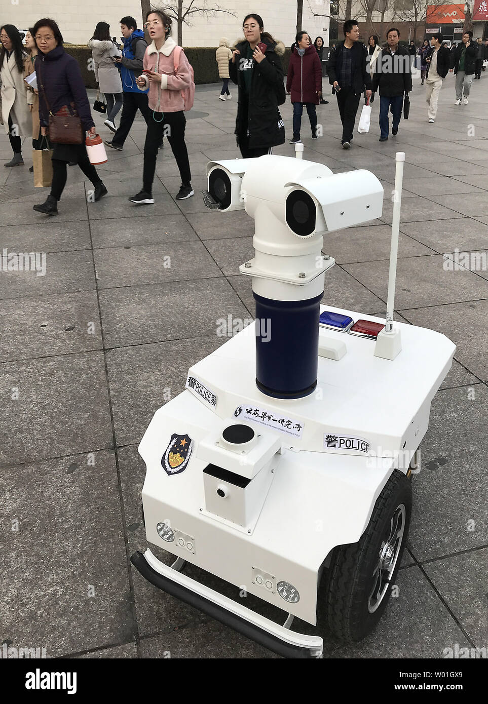 A police surveillance robot keeps watch on crowds on the streets of ...