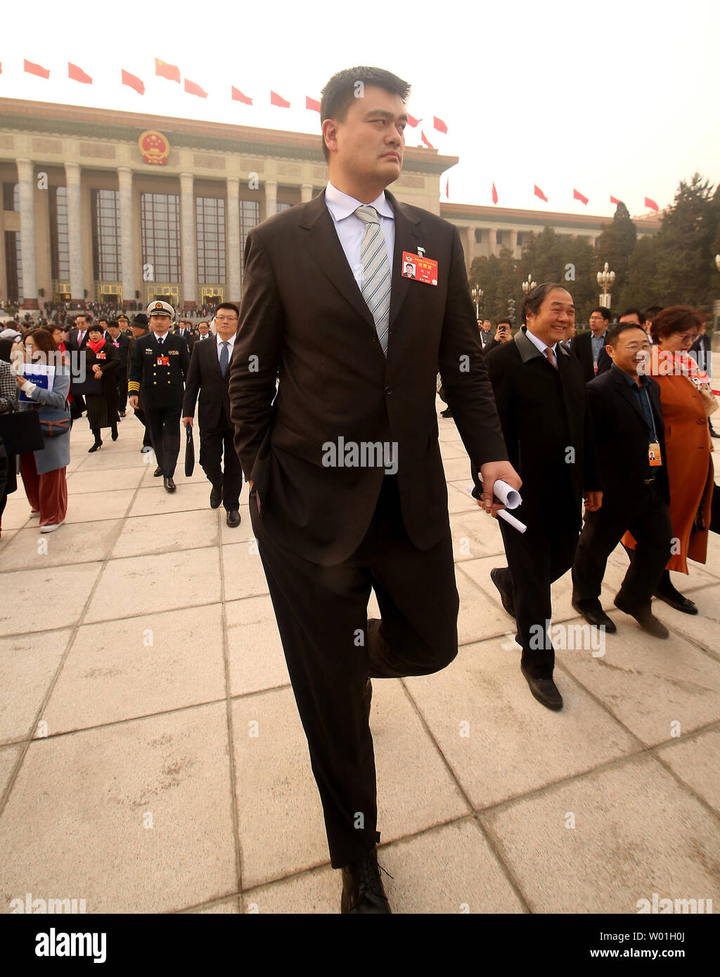 Chinese national hero and former NBA star Yao Ming leaves the closing ...