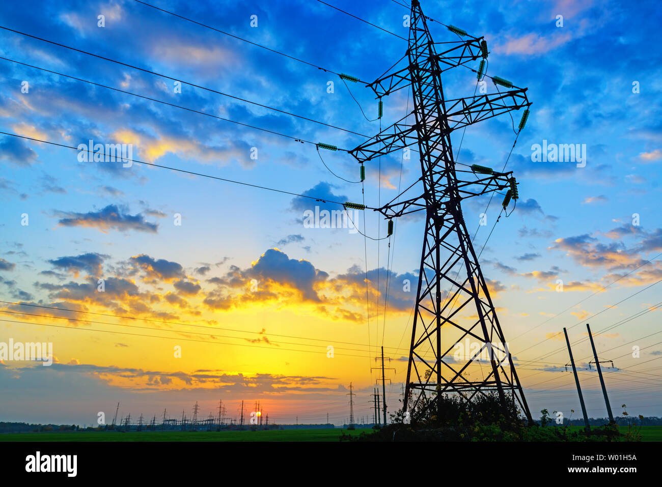 Landscape with lots of power lines at the sunset Stock Photo - Alamy