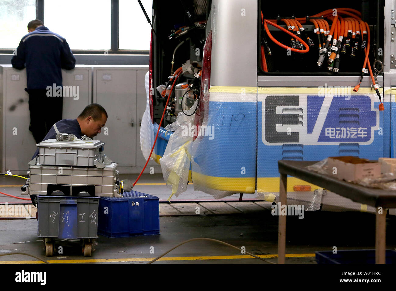 China's Foton AUV electric buses are built on an assembly line at their ...
