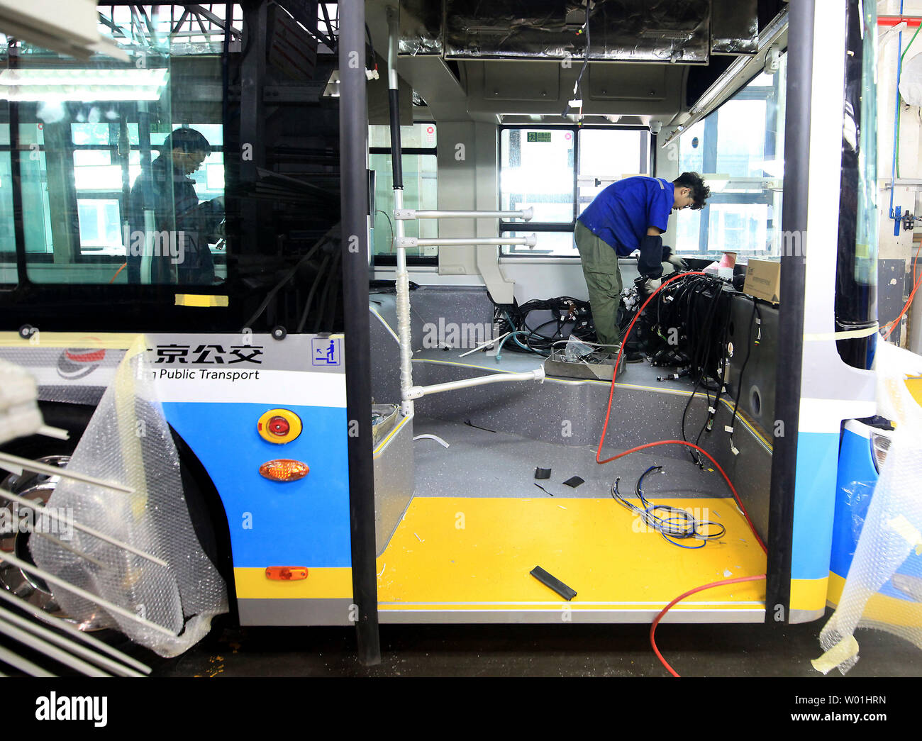 China's Foton AUV electric buses are built on an assembly line at their ...