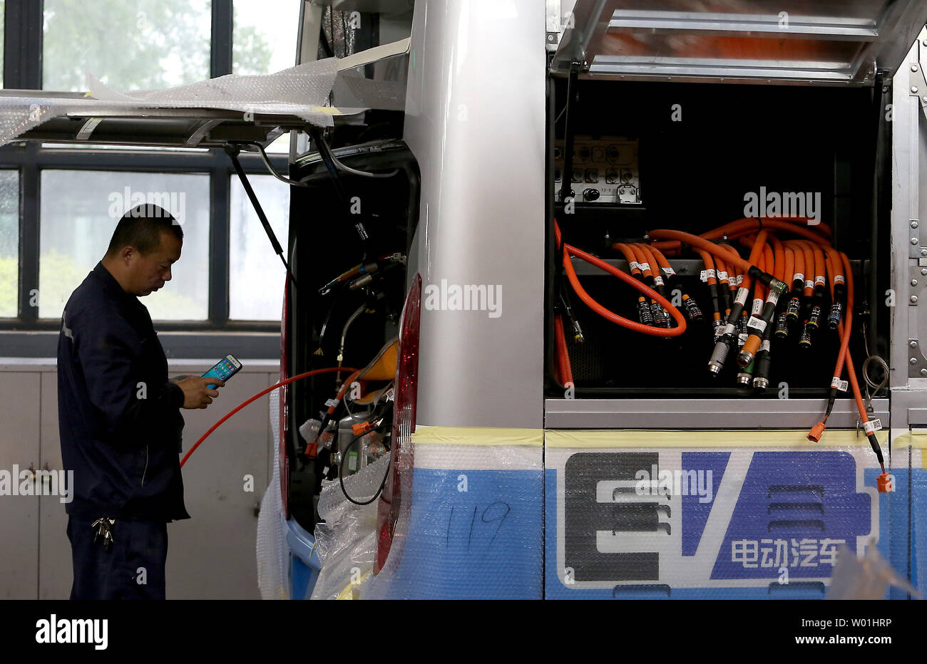 China's Foton AUV electric buses are built on an assembly line at their ...