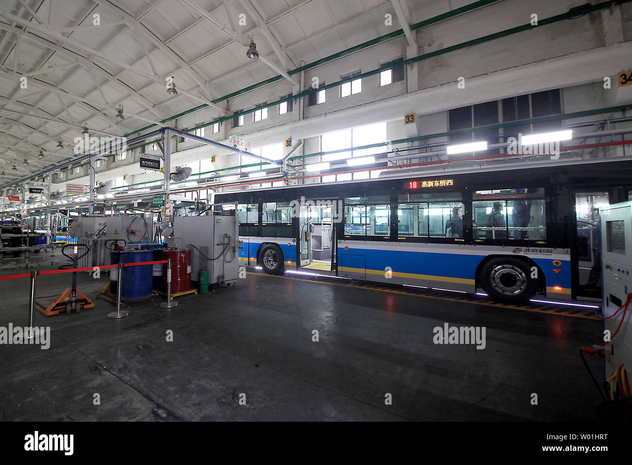 China's Foton AUV electric buses are built on an assembly line at their ...