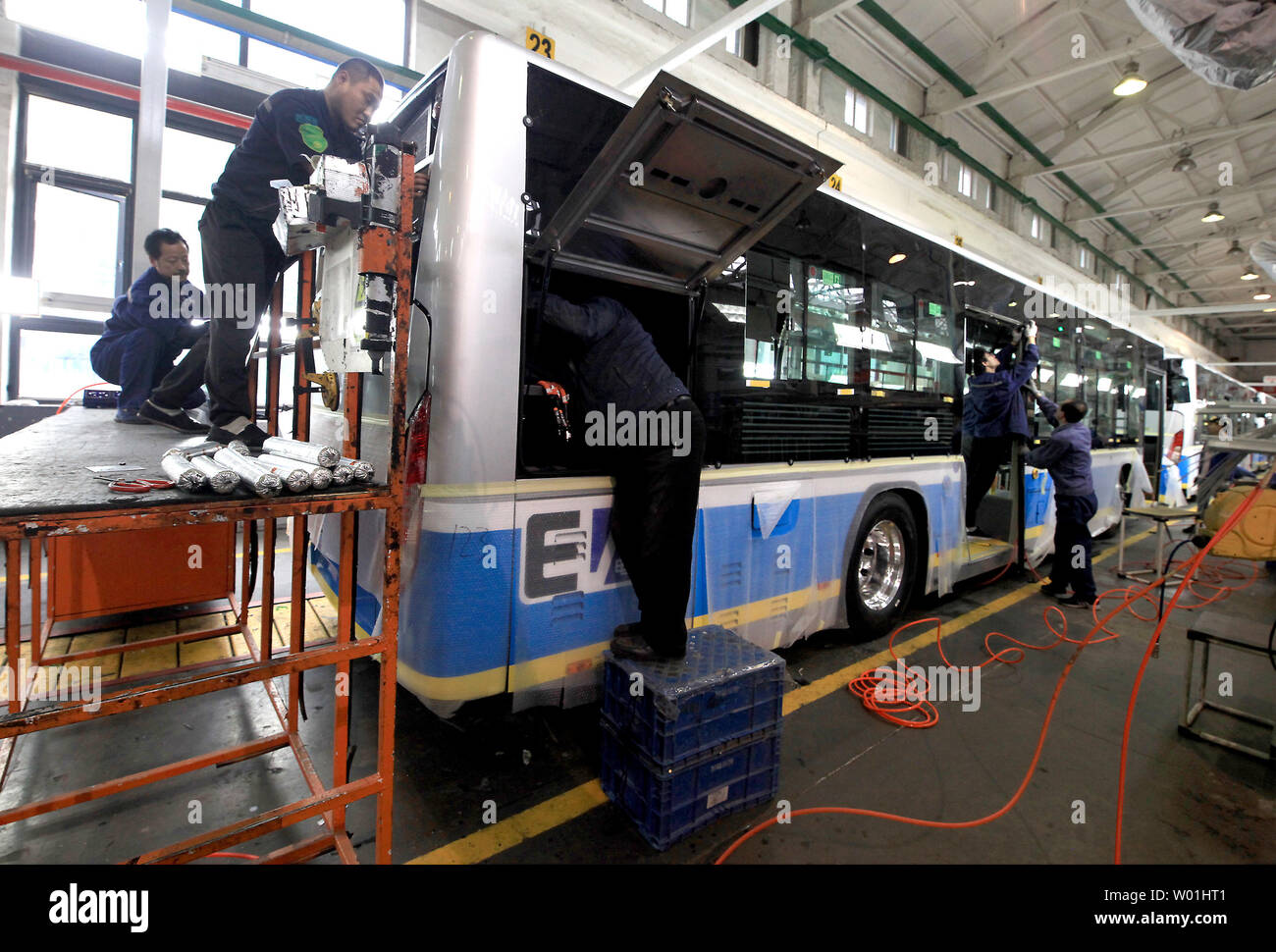 China's Foton AUV electric buses are built on an assembly line at their ...