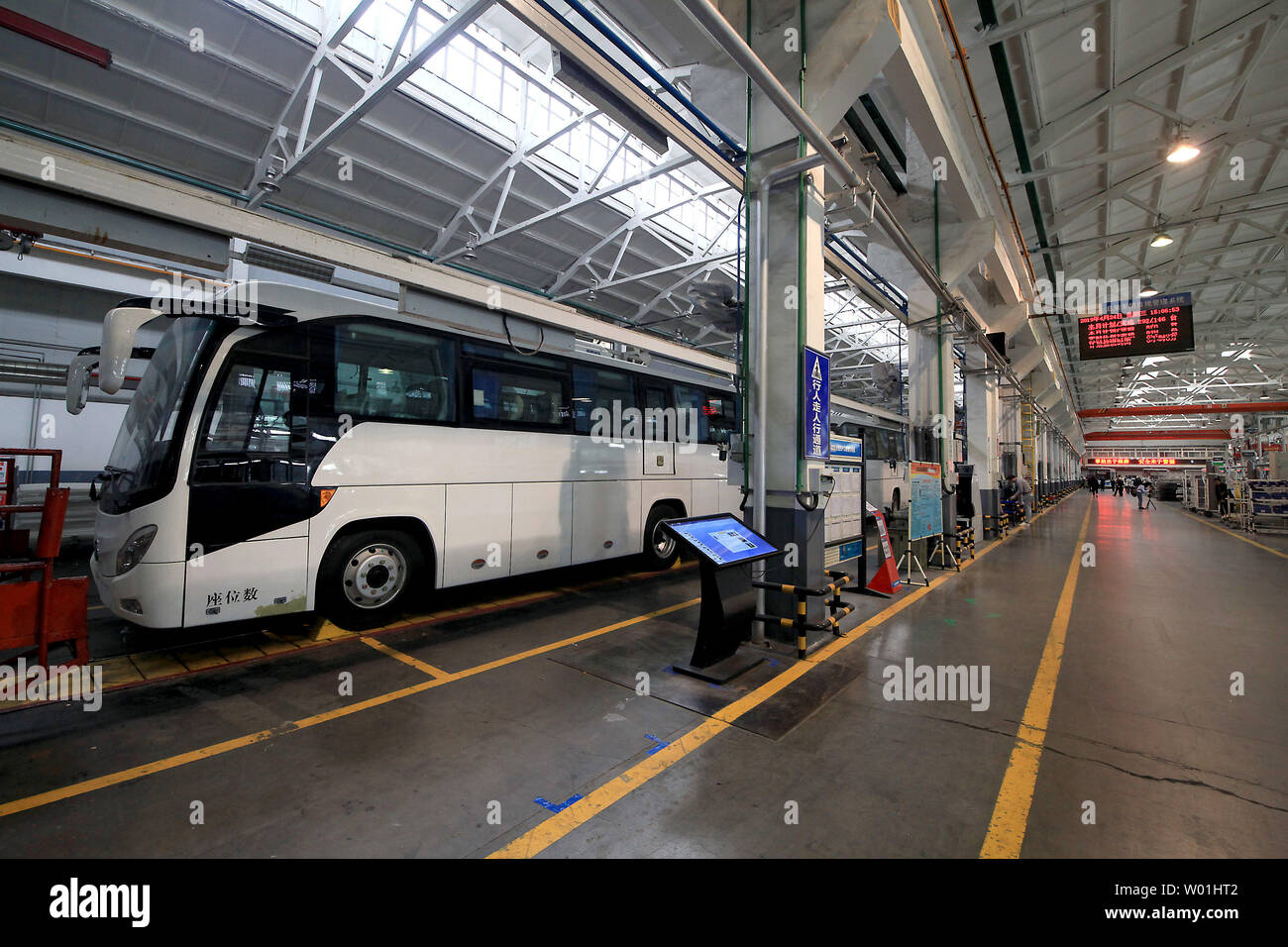 China's Foton AUV electric buses are built on an assembly line at their ...