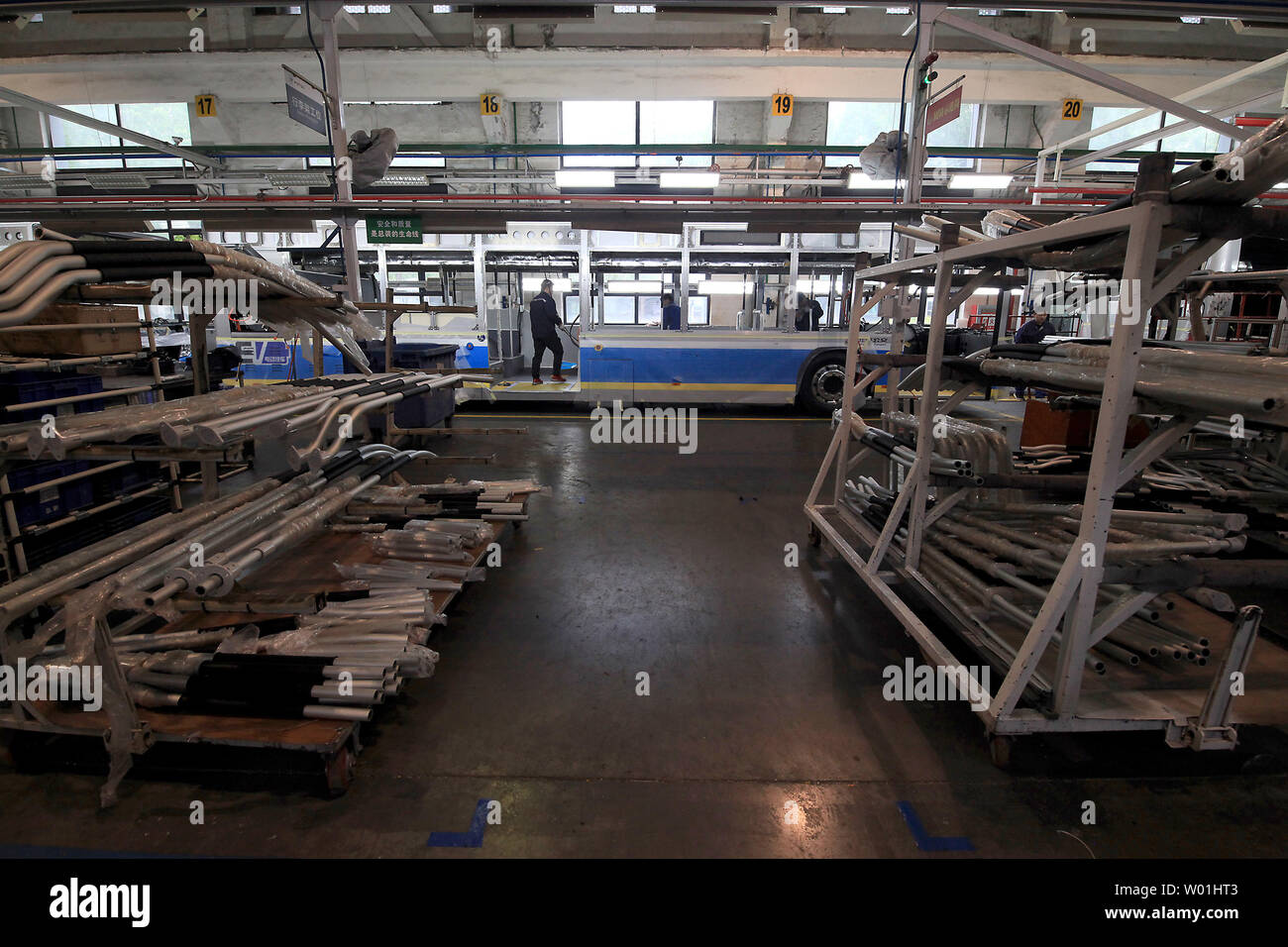 China's Foton AUV electric buses are built on an assembly line at their ...