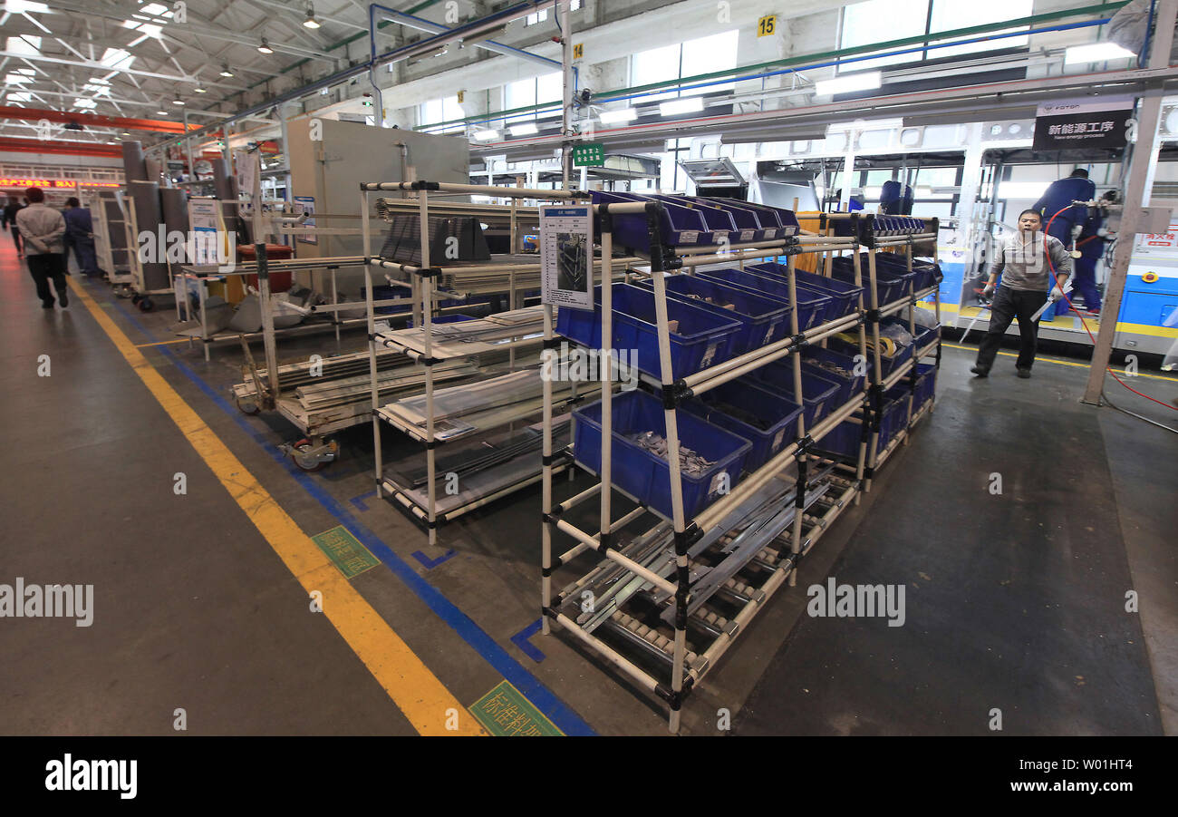 China's Foton AUV electric buses are built on an assembly line at their ...