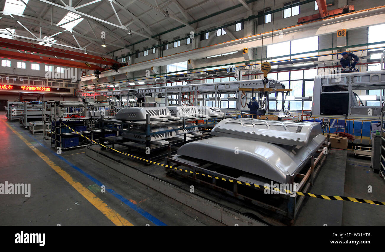 China's Foton AUV electric buses are built on an assembly line at their ...