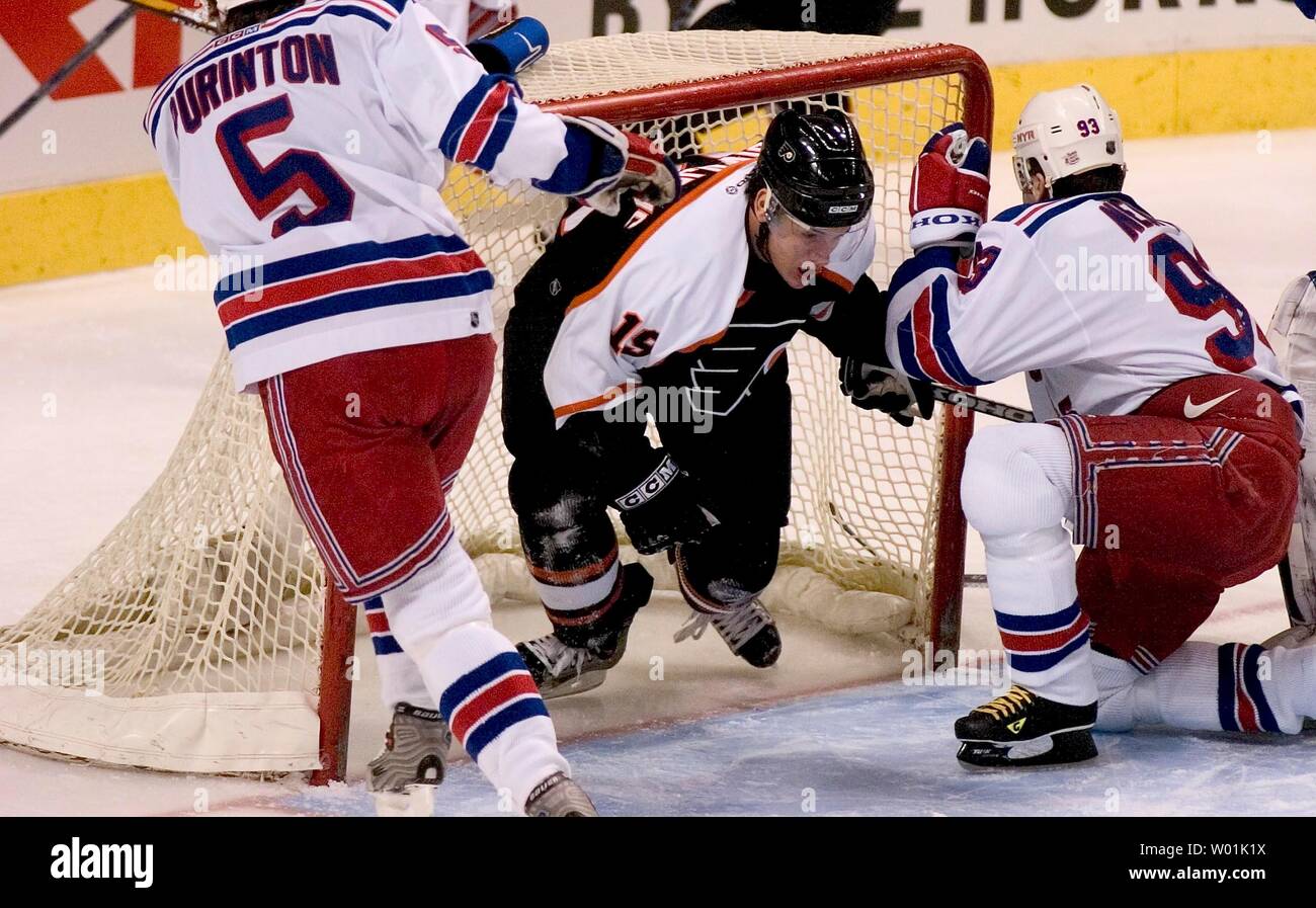 The Rangers' Dale Purinton(5) and Petr Nedved route the Flyers Branko ...