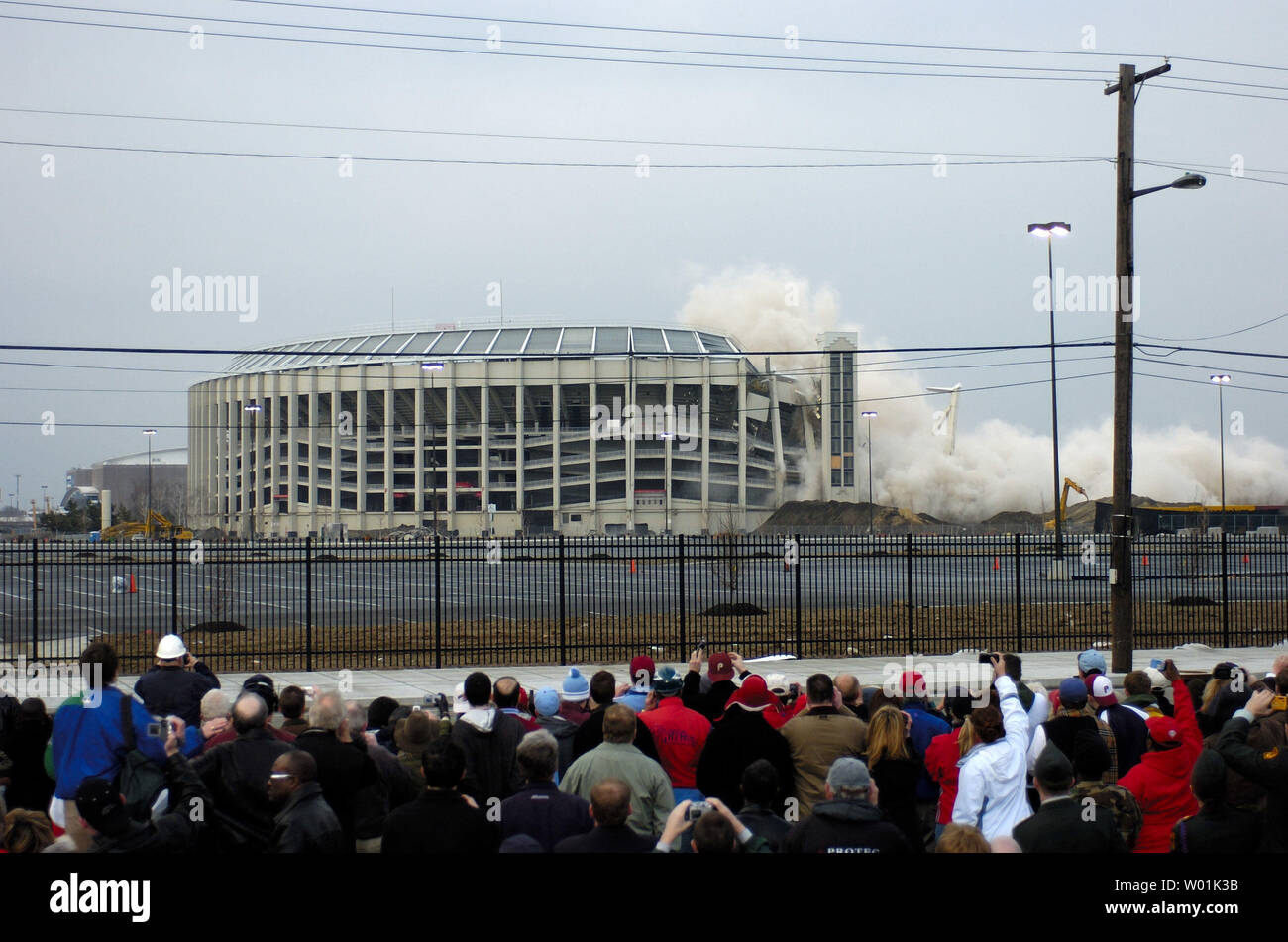 Veterans Stadium comes tumbling down in a series of explosions as a ...