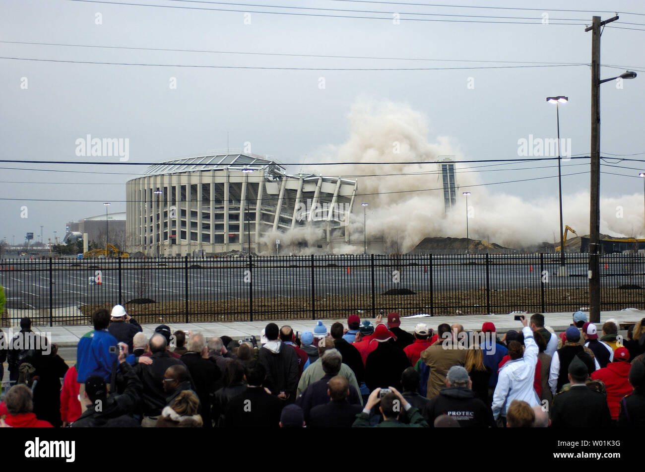 Veterans Stadium comes tumbling down in a series of explosions as a ...