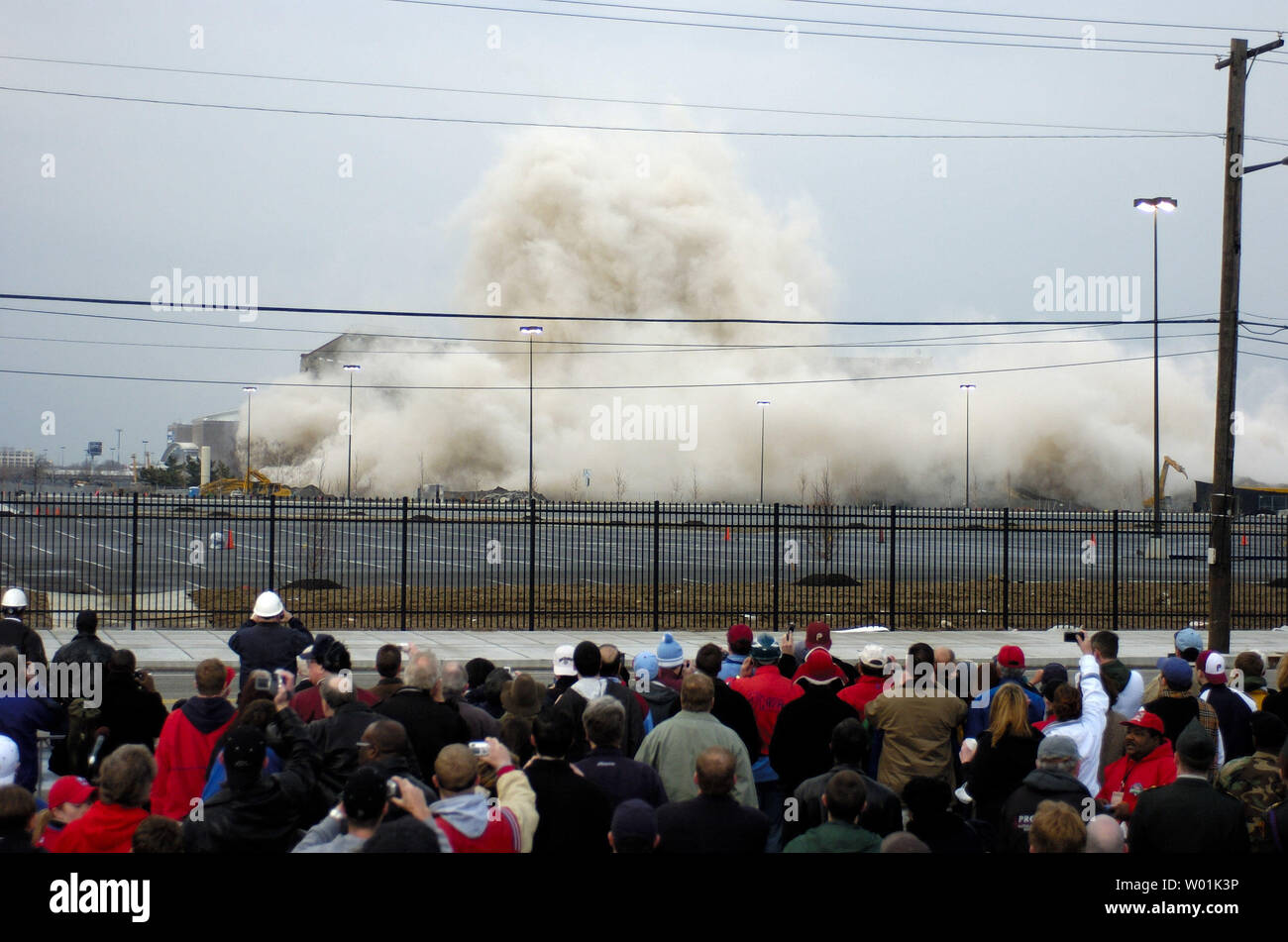 Veterans Stadium comes tumbling down in a series of explosions as a ...