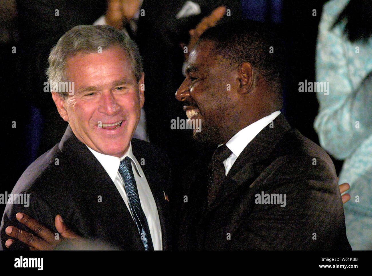 President George Bush is presented by the reverend Pastor Herbert Lusk ...