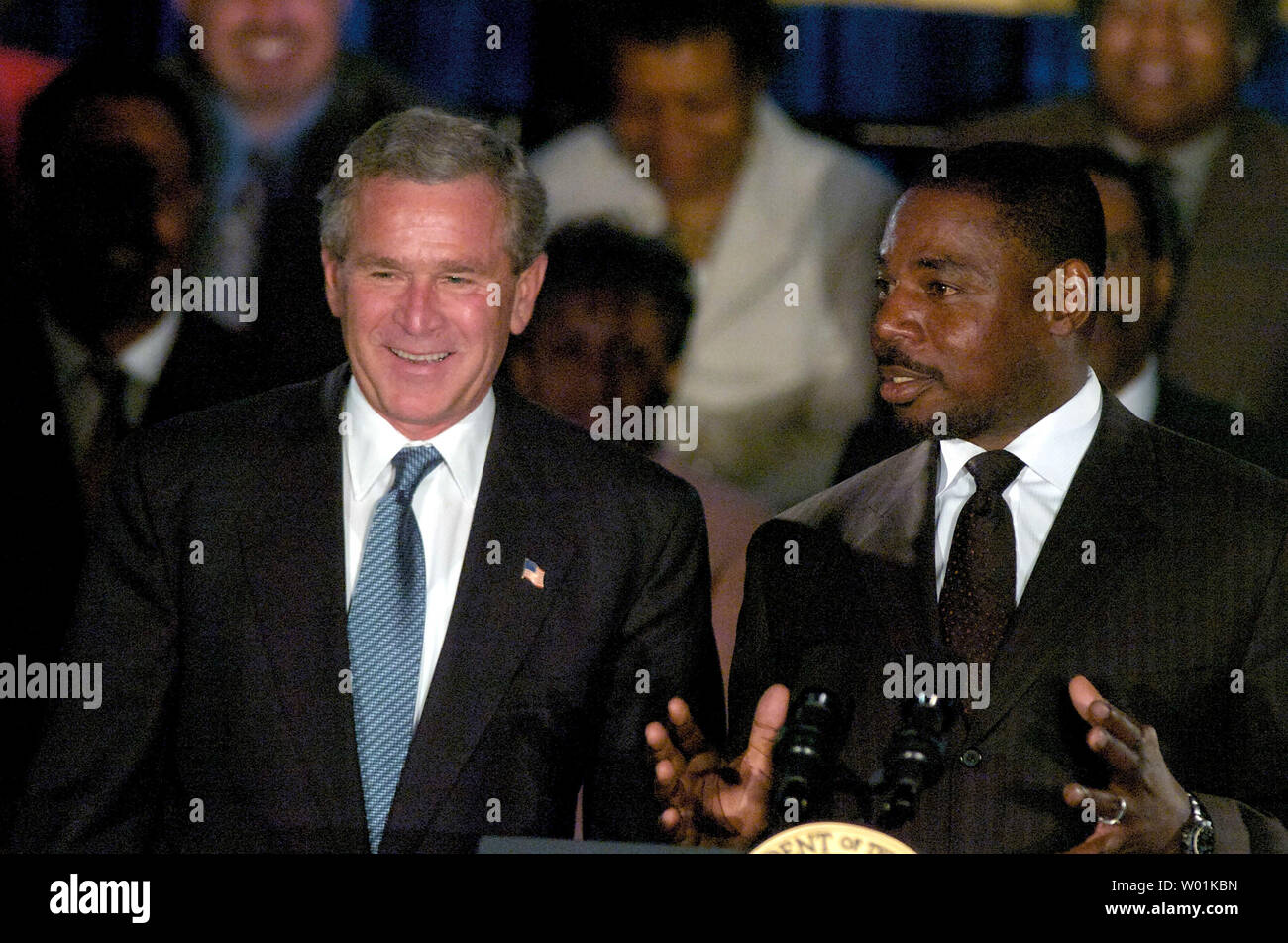 President George Bush is presented by the reverend Pastor Herbert Lusk ...